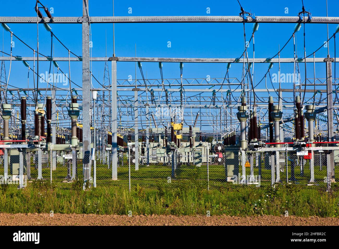 electrical power plant in beautiful colorful meadow Stock Photo - Alamy
