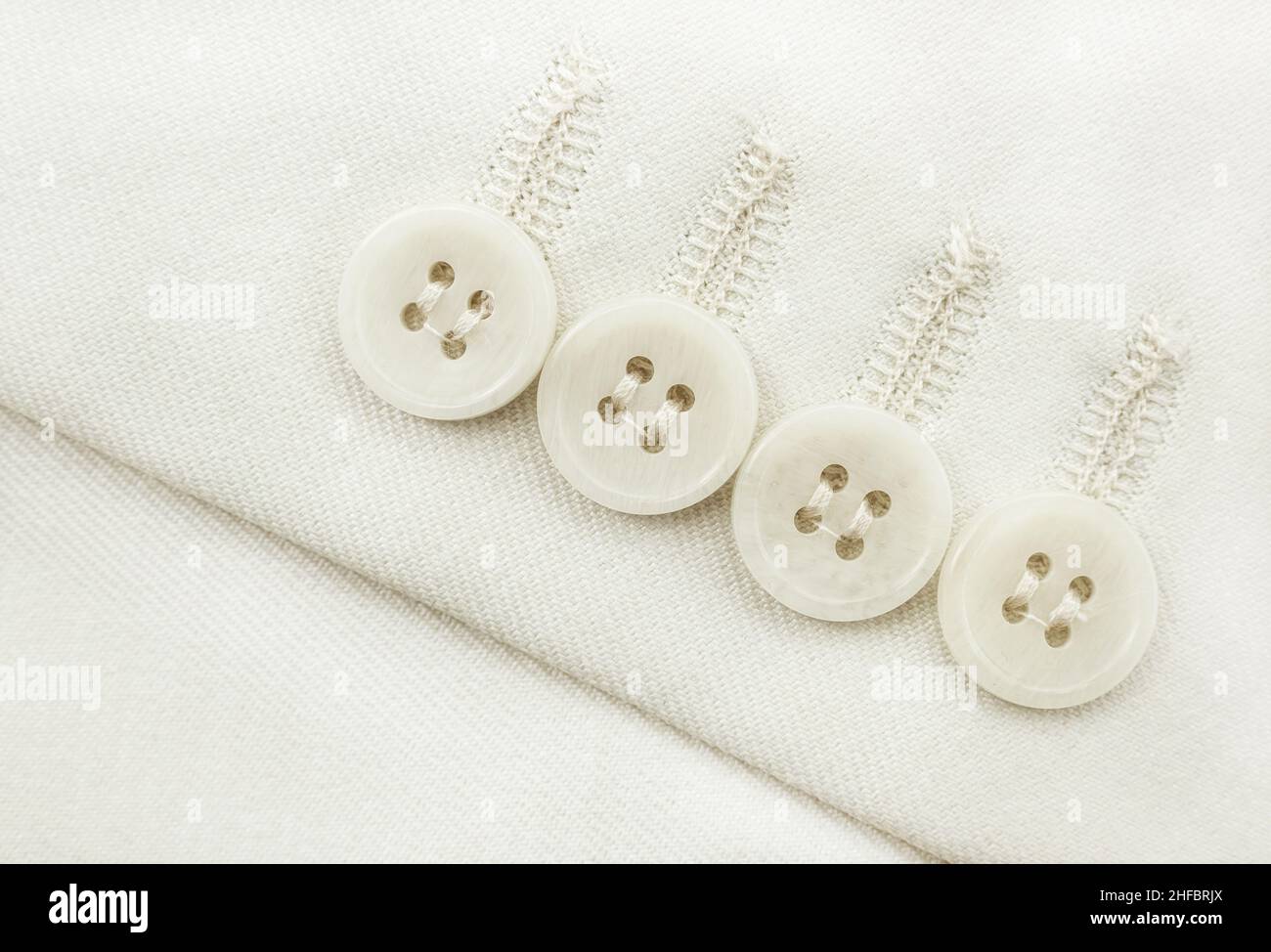 Buttons on white clothes. Element of men's clothing. Sleeve with ...