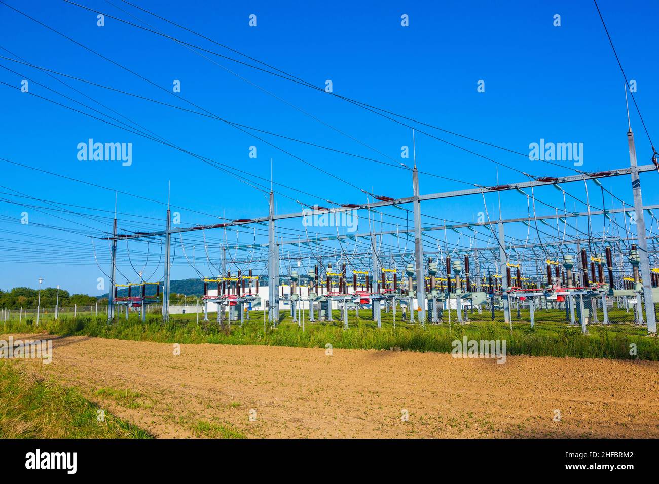 electrical power plant in beautiful colorful meadow Stock Photo - Alamy