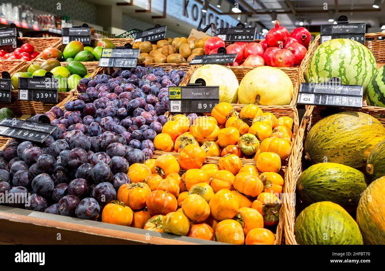 Samara, Russia - October 16, 2021: Fresh plum, persimmon, melons and ...