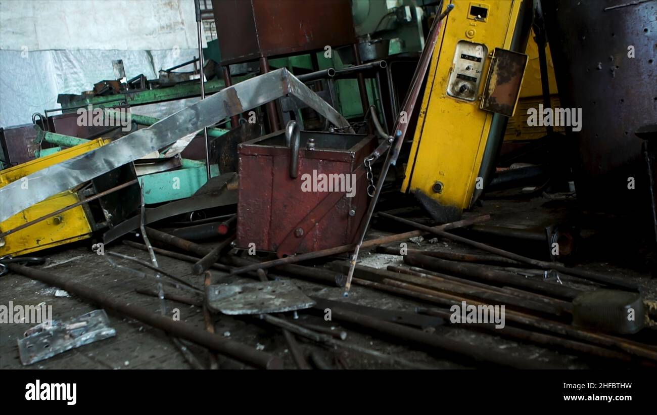 Abandoned old, useless details of machine tools in workshop, metal ...