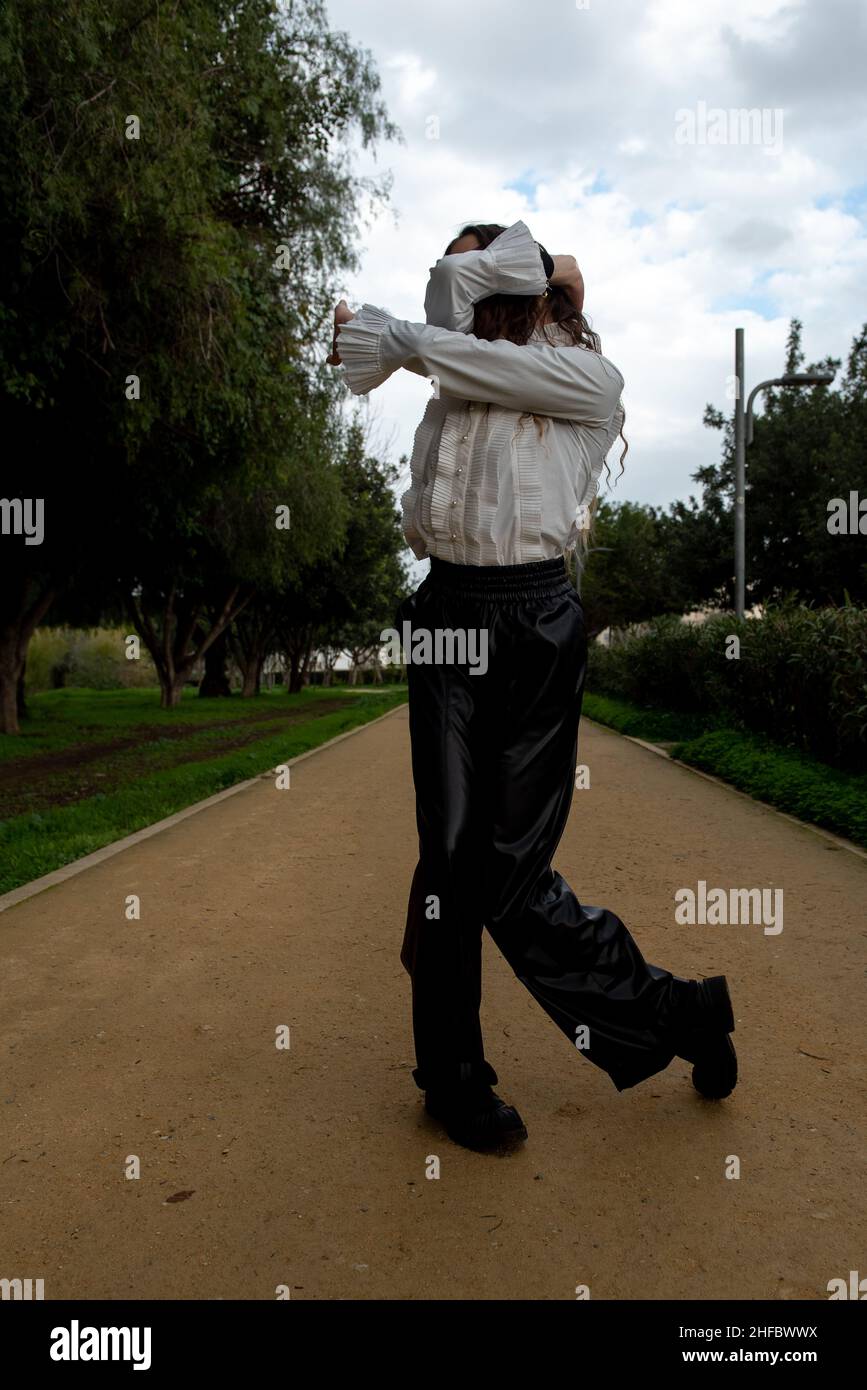 Young woman dancing outdoors. Dance performance in the street Stock ...