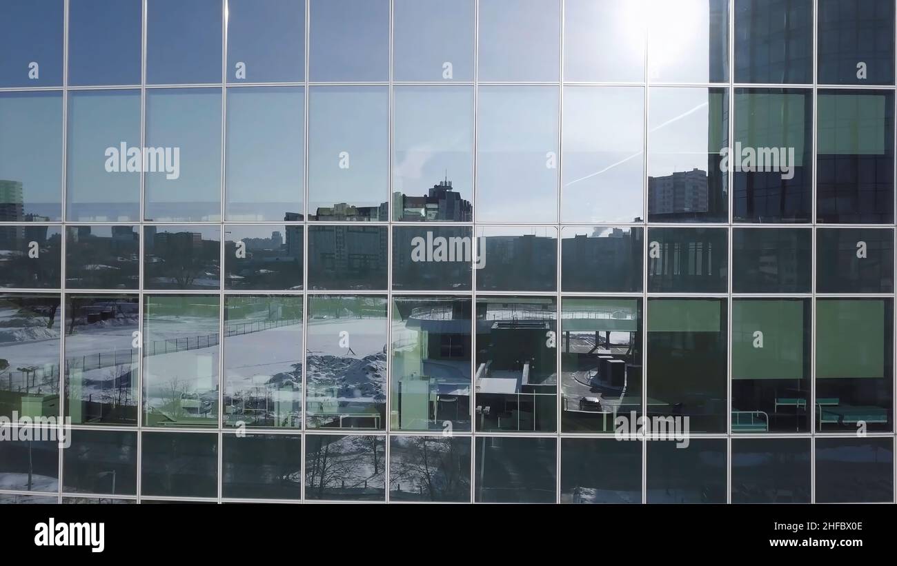 Abstract reflections of tall buildings from glass skyscraper facade ...