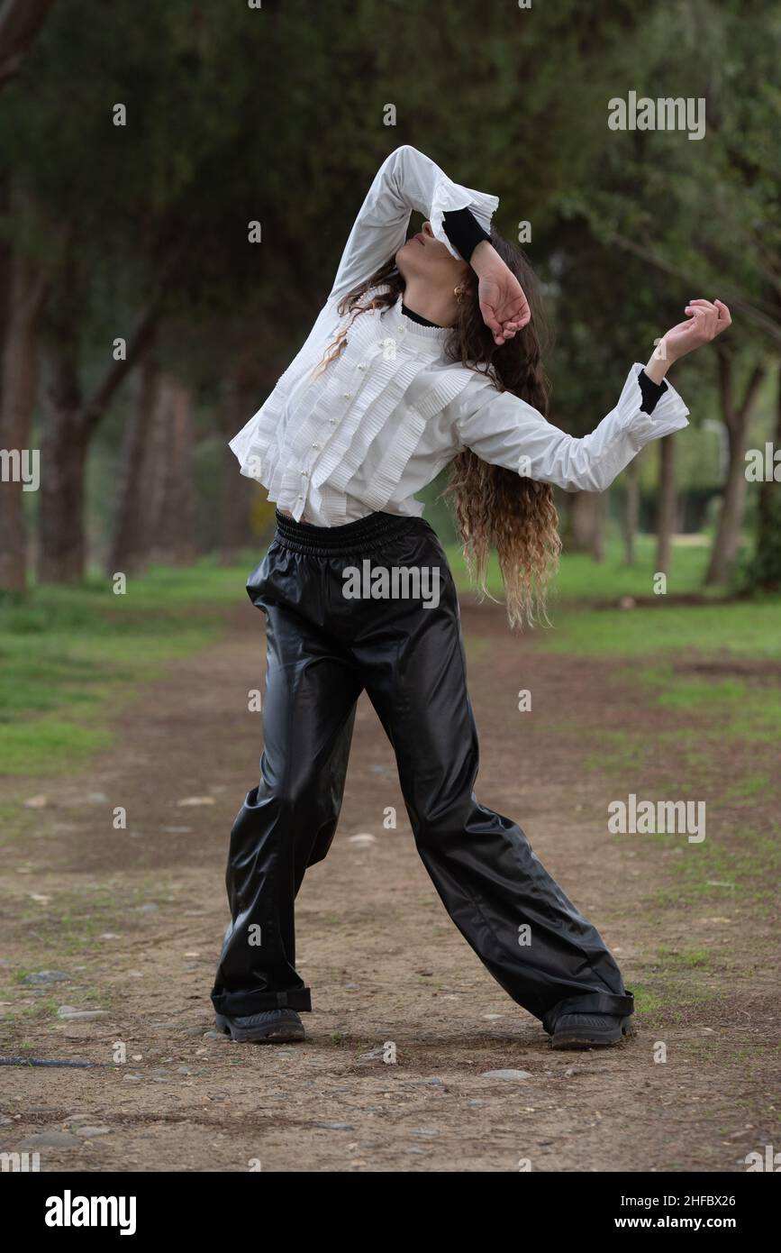 Young woman dancing outdoors. Dance performance in the street Stock ...