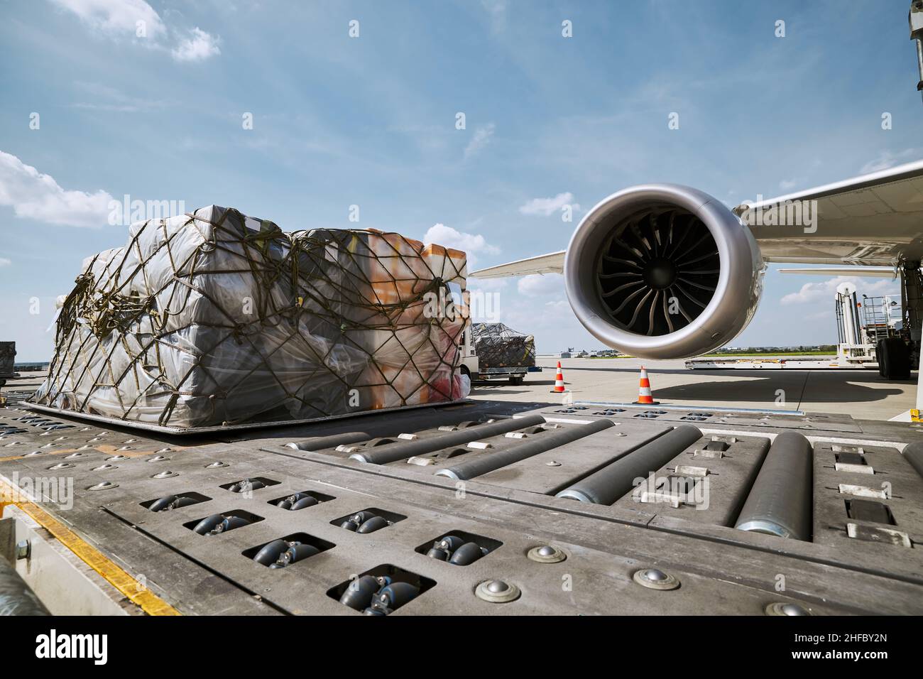 Preparation fright airplane before flight. Loading of cargo containers ...