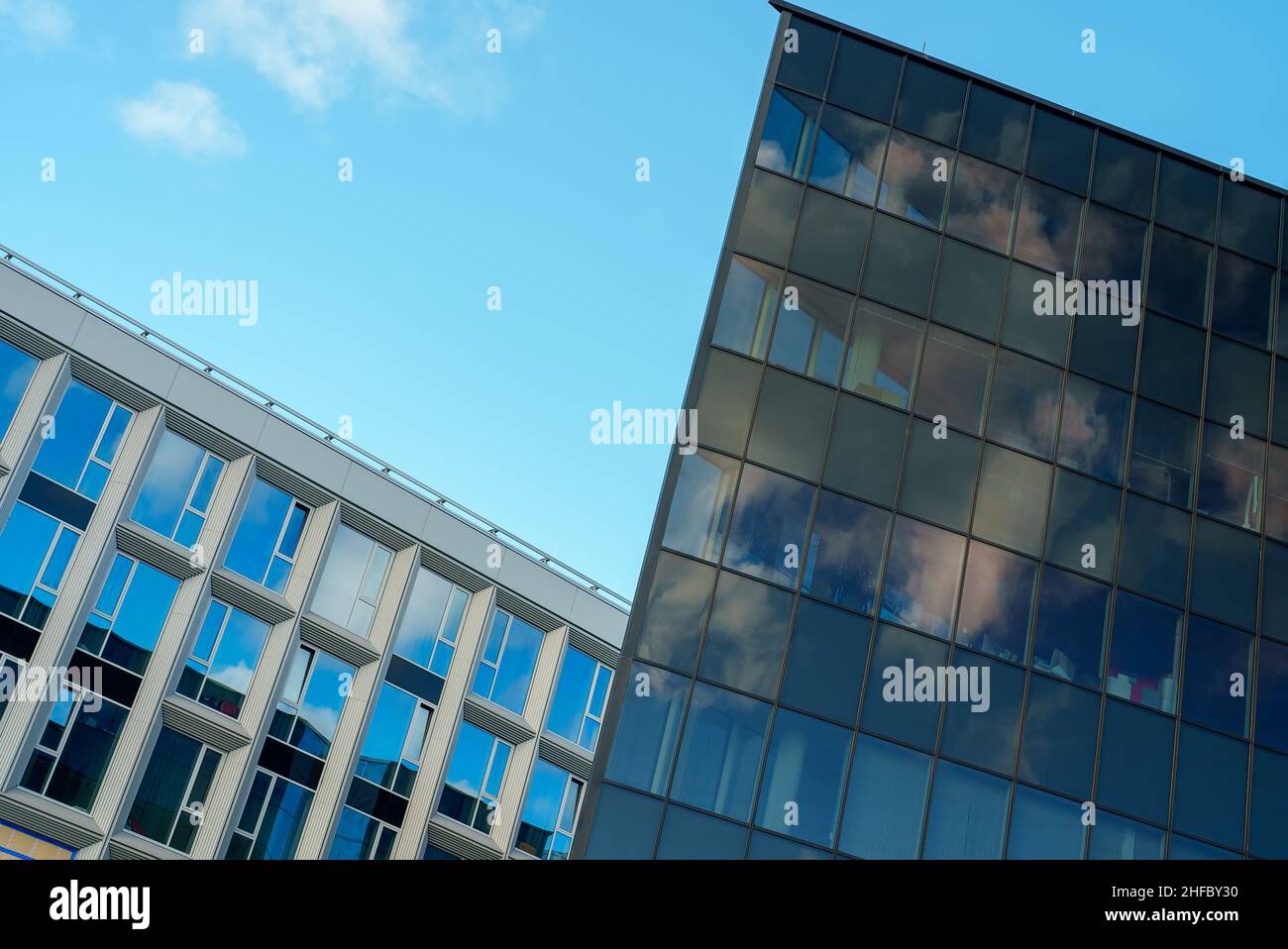 Modern office building with blue windows Stock Photo - Alamy