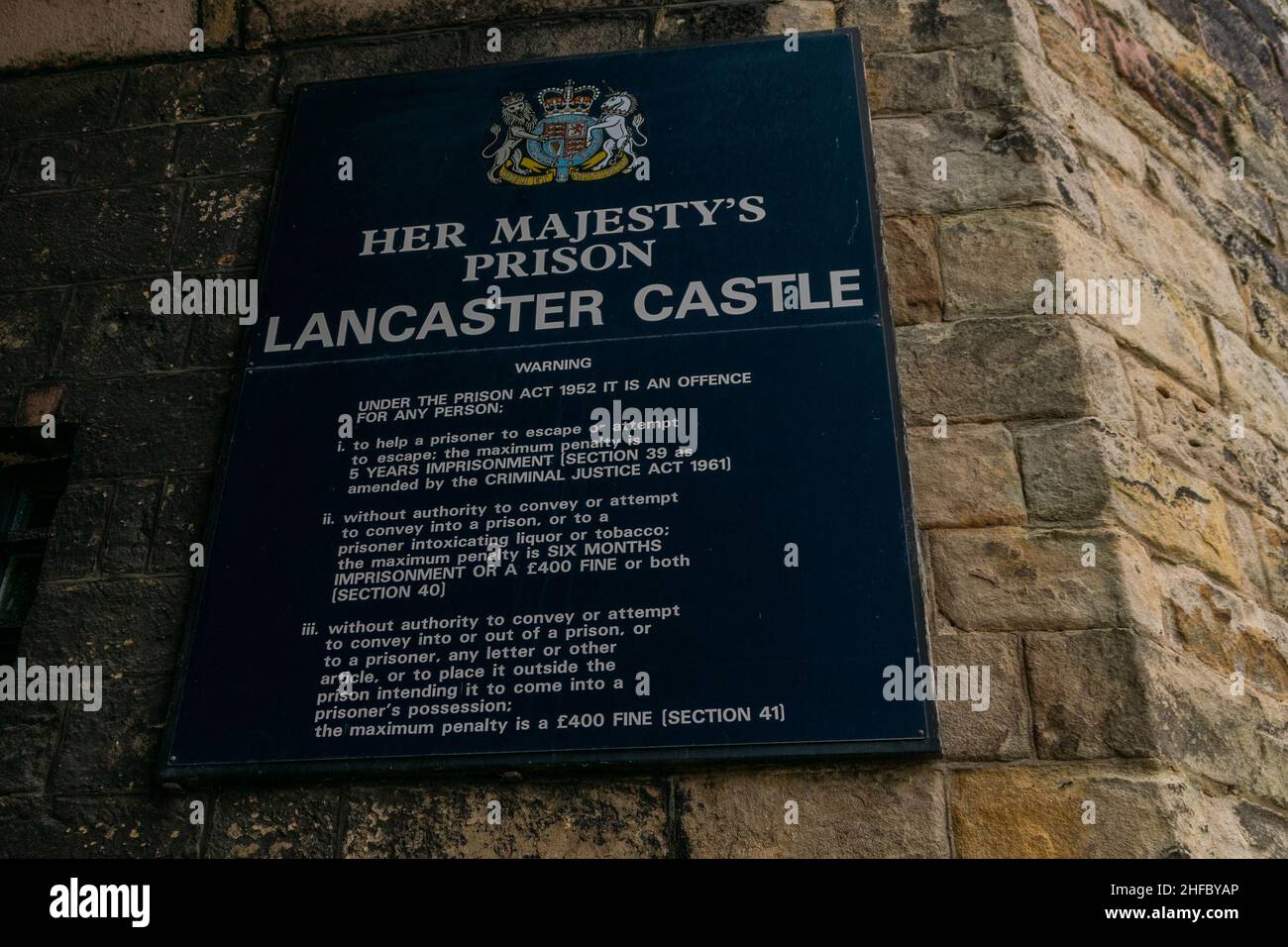 Plaque on the entrance to Lancaster castle, owned by the serving ...