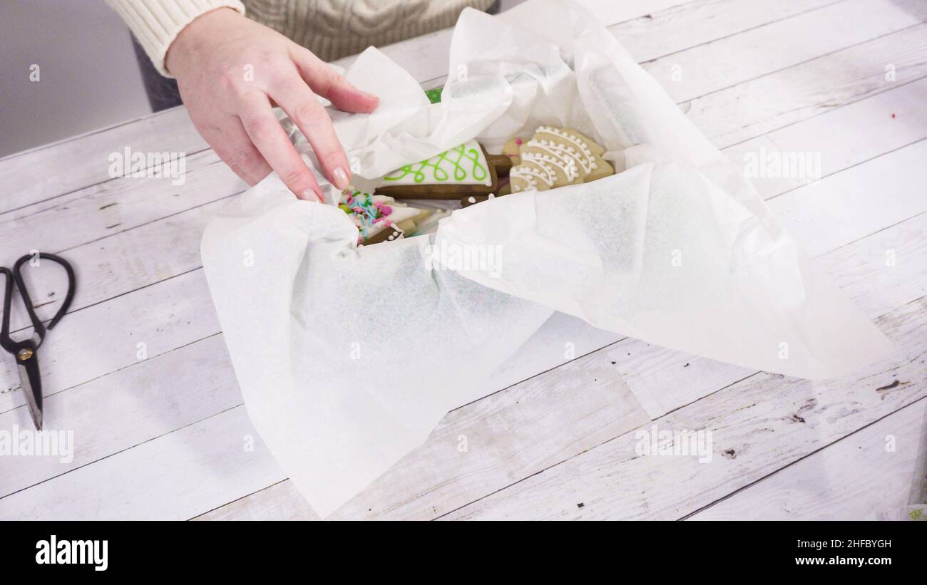 Step by step. Packaging homemade fudge and cookies into a Christmas ...