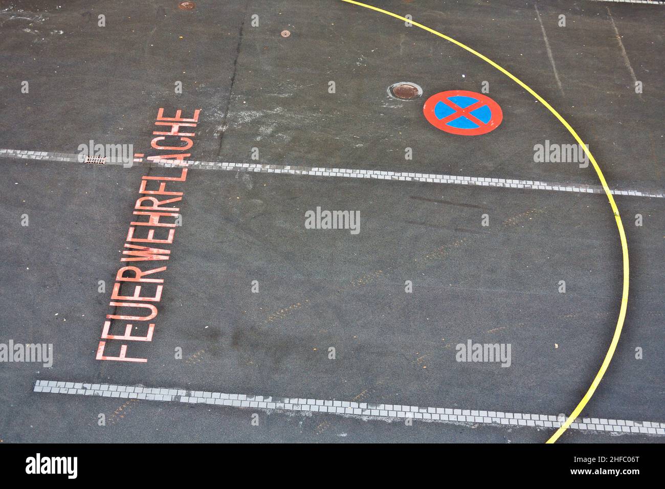 marked parking lot without cars for fire brigade Stock Photo - Alamy