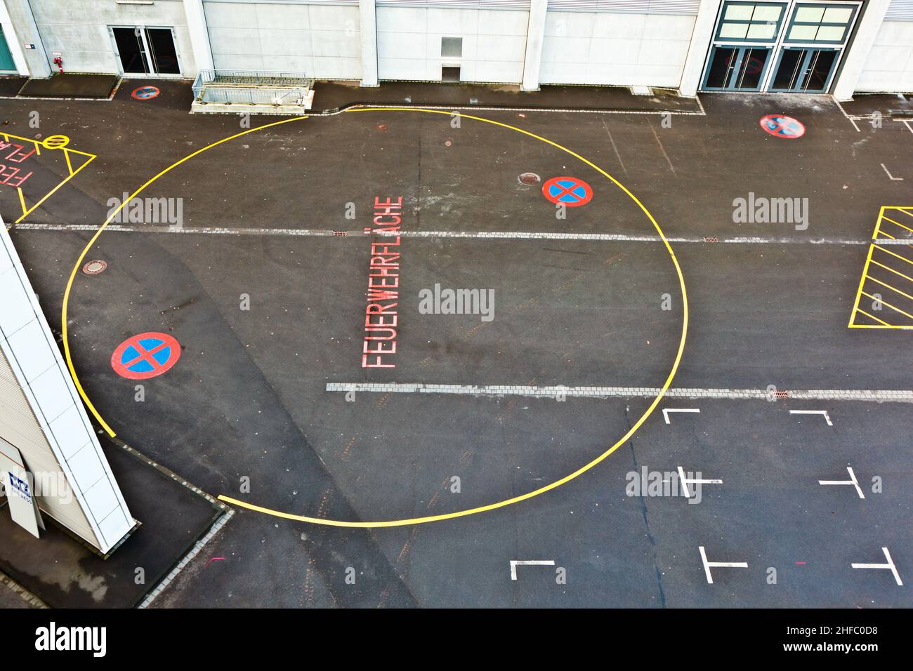 marked parking lot without cars for fire brigade Stock Photo - Alamy