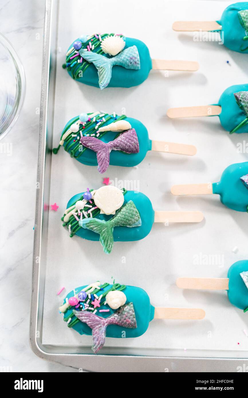 Mermaid cakesicles with drizzled chocolate, chocolate mermaid tails ...