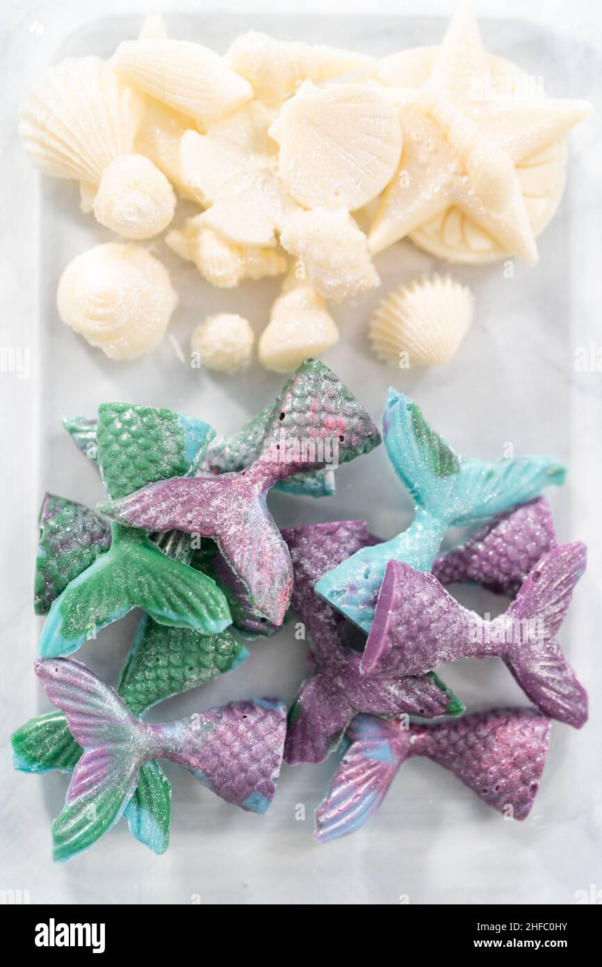 Chocolate seashells and mermaid tails in a glass container Stock Photo ...