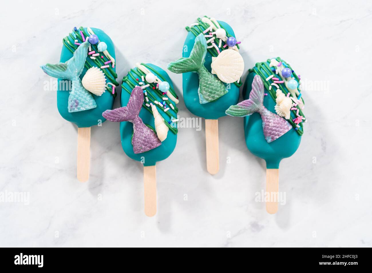Mermaid cakesicles with drizzled chocolate, chocolate mermaid tails ...