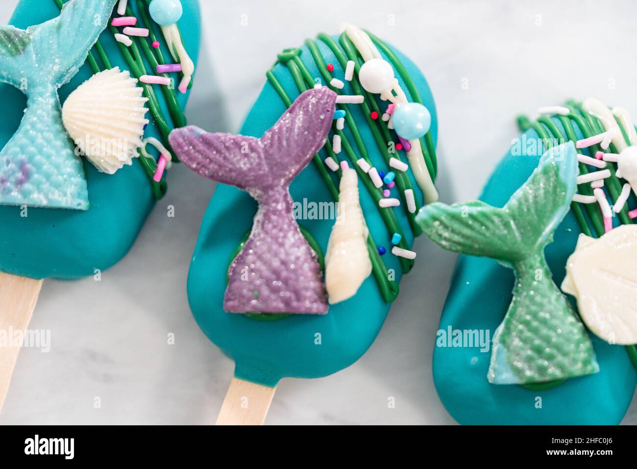 Mermaid cakesicles with drizzled chocolate, chocolate mermaid tails ...