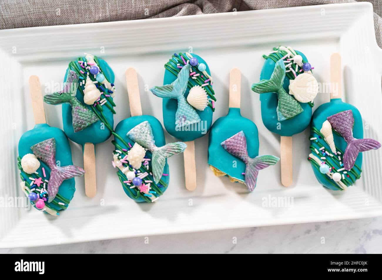 Mermaid cakesicles with drizzled chocolate, chocolate mermaid tails ...
