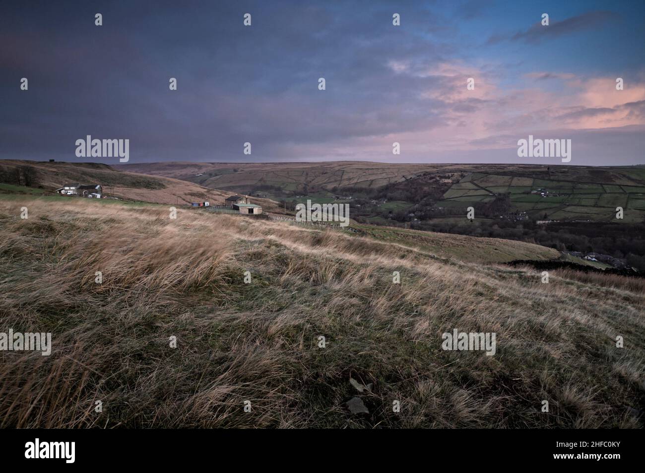 Dawn light on clouds over Buckstones across Hades Farm and Haigh House ...