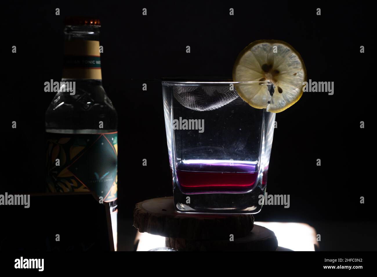 light shot on black background showing glass fileld with mulled infused ...