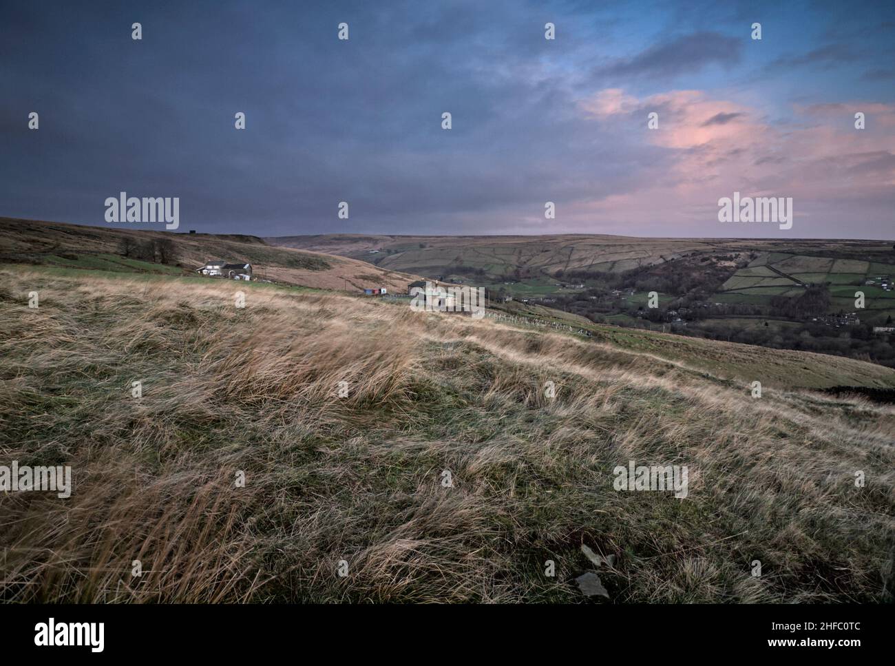 Dawn light on clouds over Buckstones across Hades Farm and Haigh House ...