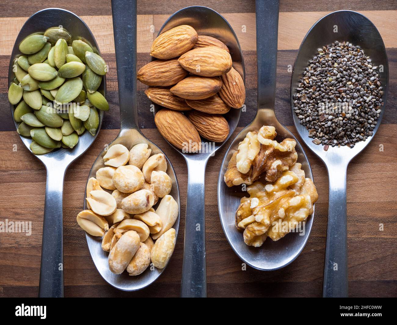 Several kinds of nuts on spoons Stock Photo - Alamy