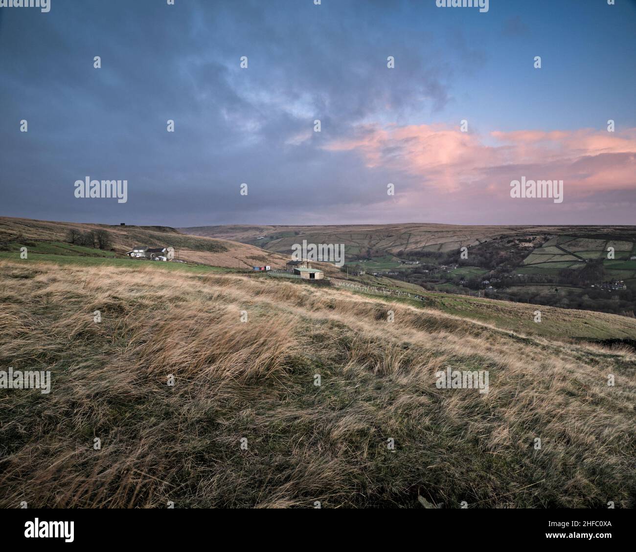 Dawn light on clouds over Buckstones across Hades Farm and Haigh House ...