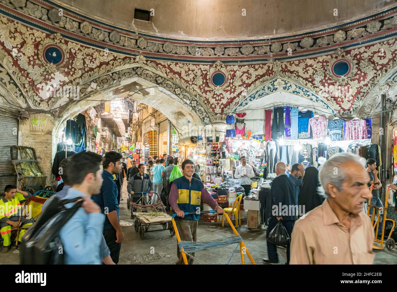 Shoppers and traders walking through a busy Grand Bazaar in Tehran ...