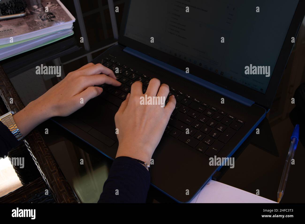 young girl studying while using a laptop computer Stock Photo - Alamy