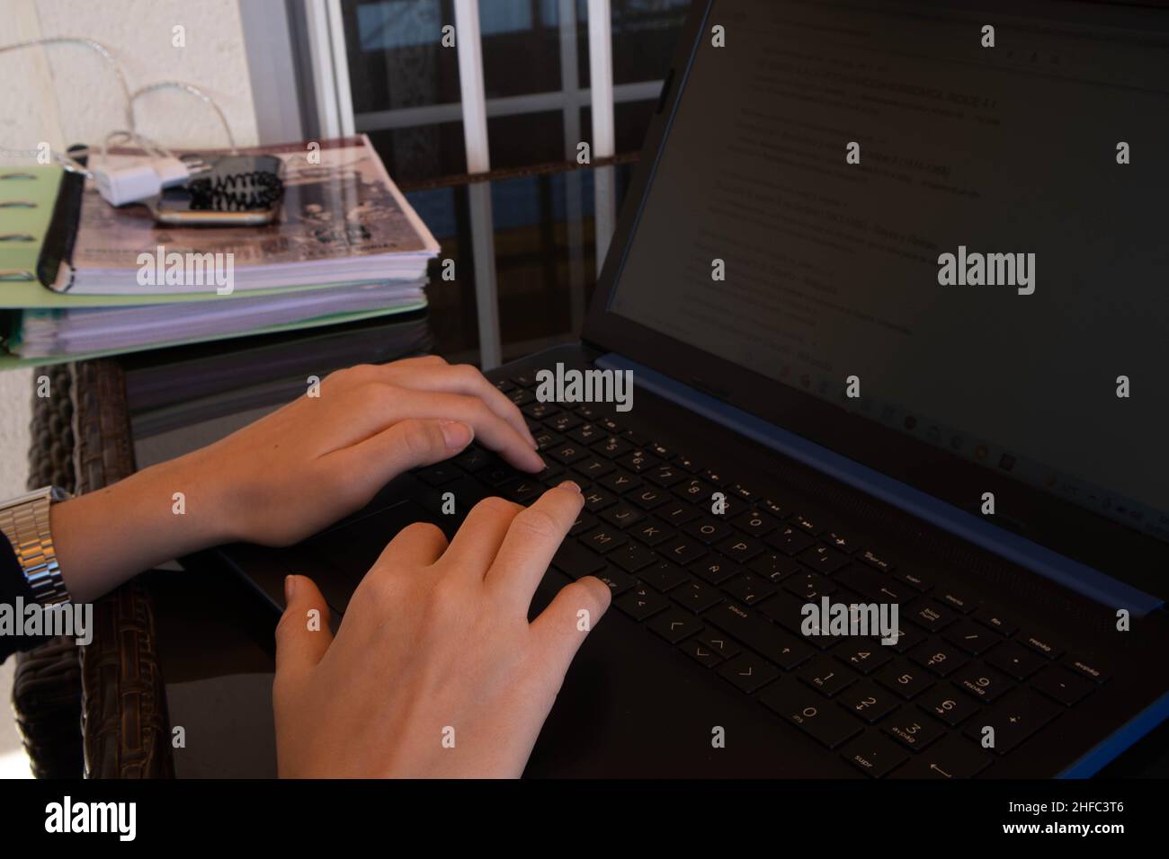 young girl studying while using a laptop computer Stock Photo - Alamy