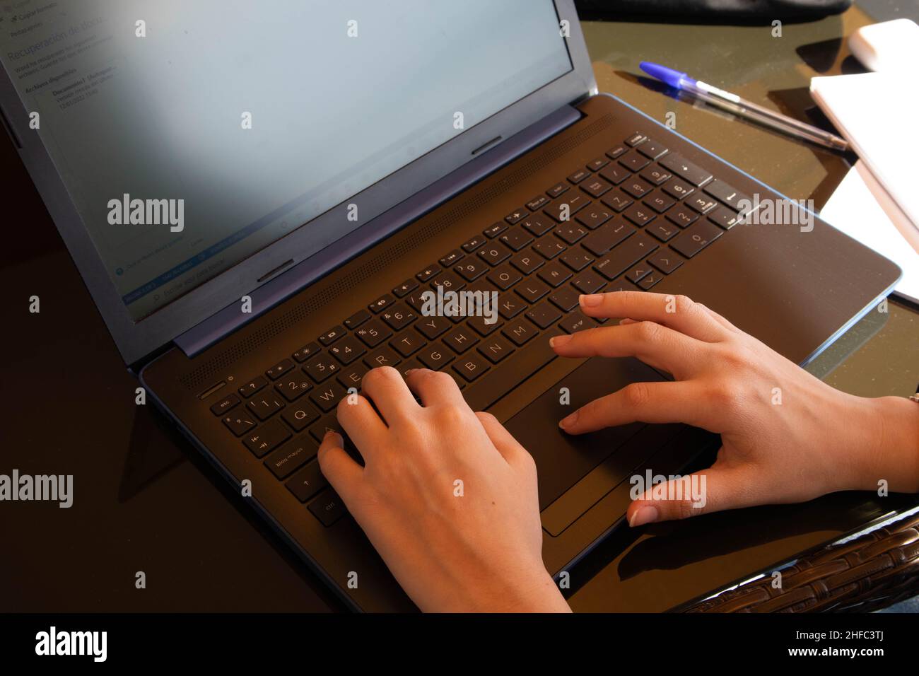 young girl studying while using a laptop computer Stock Photo - Alamy