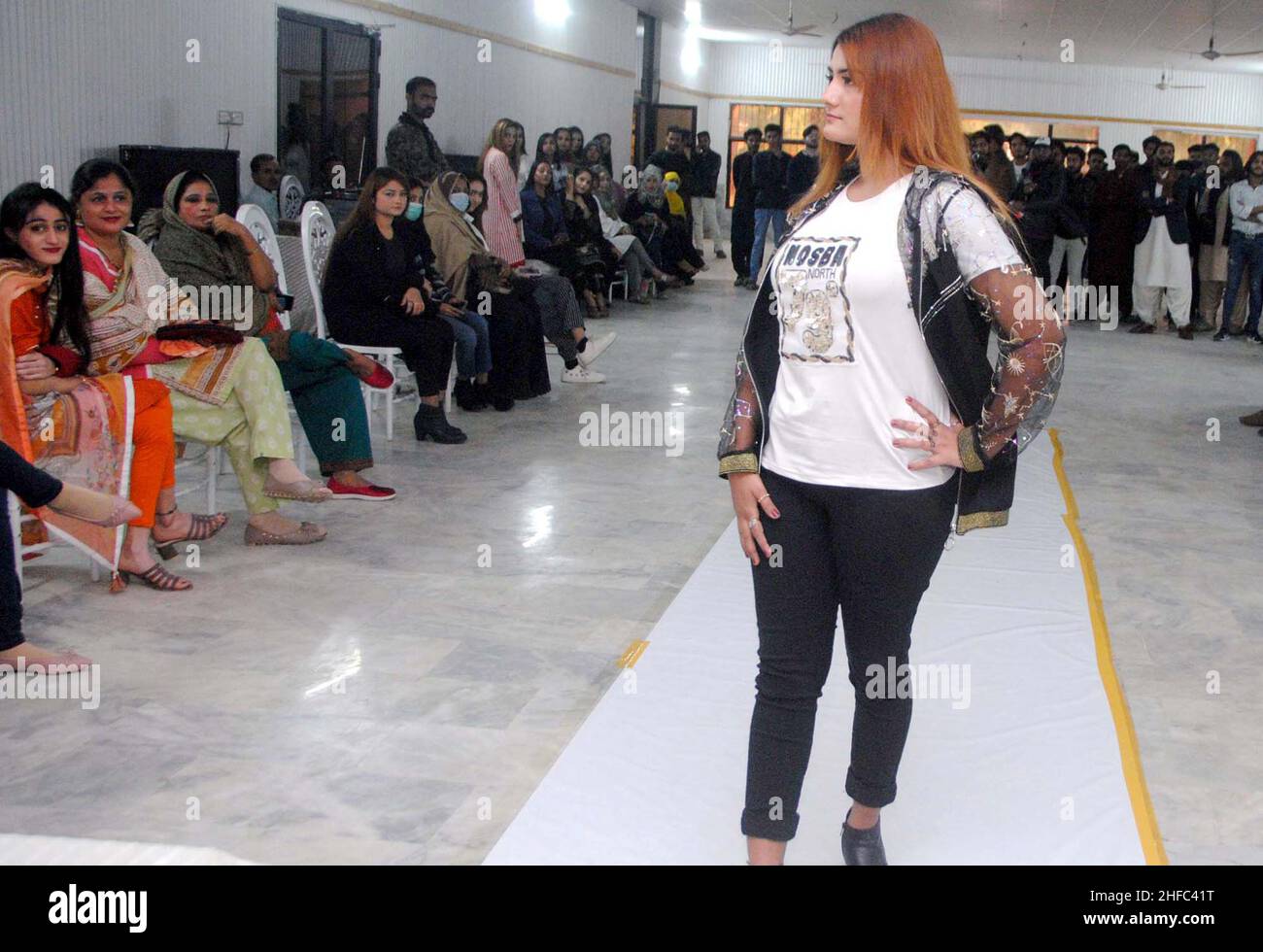 Pakistan. 15th Jan, 2022. Models are performing cat walk on ramp during ...