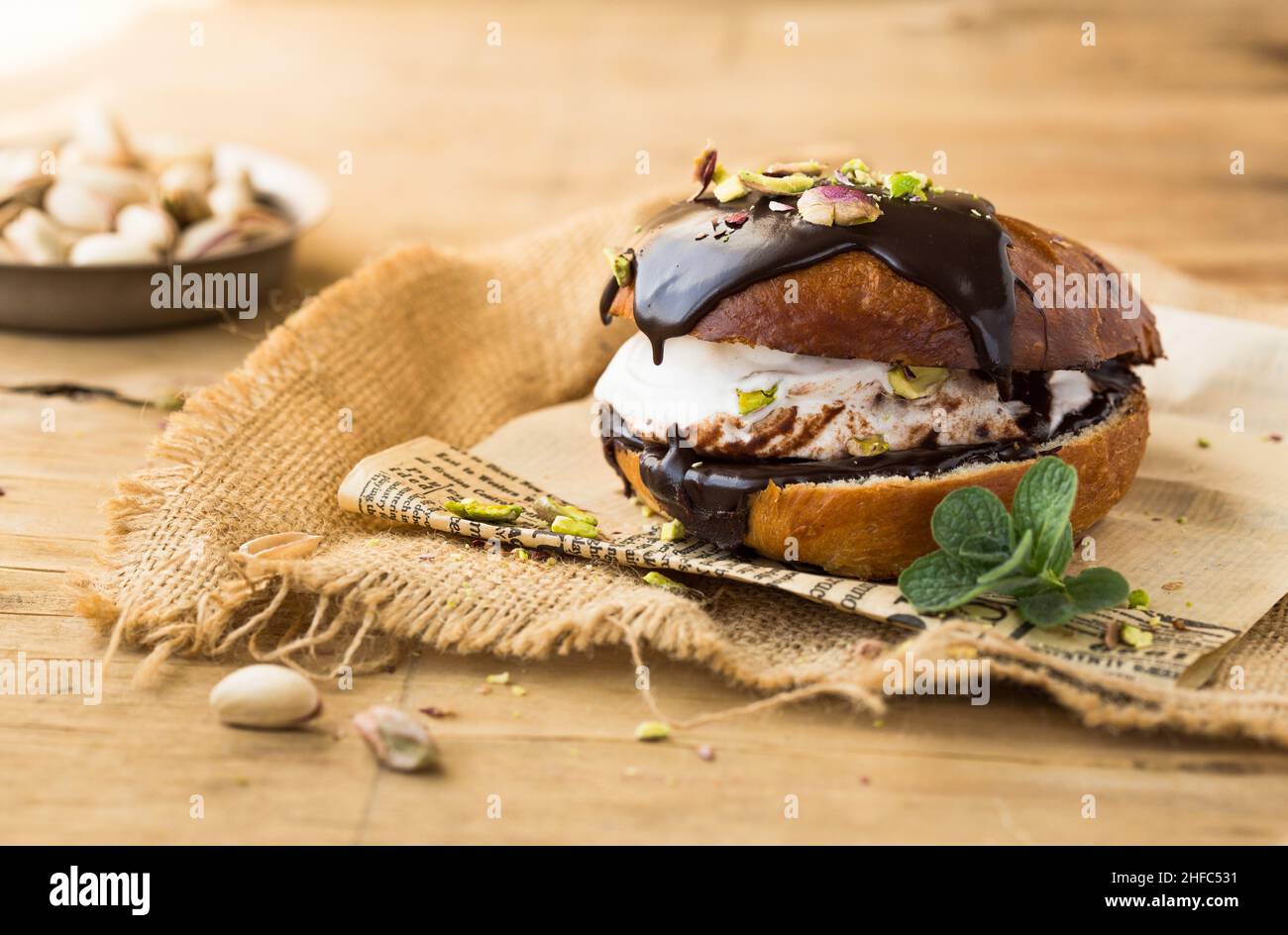 ice cream burger on wooden table. American dessert Stock Photo - Alamy