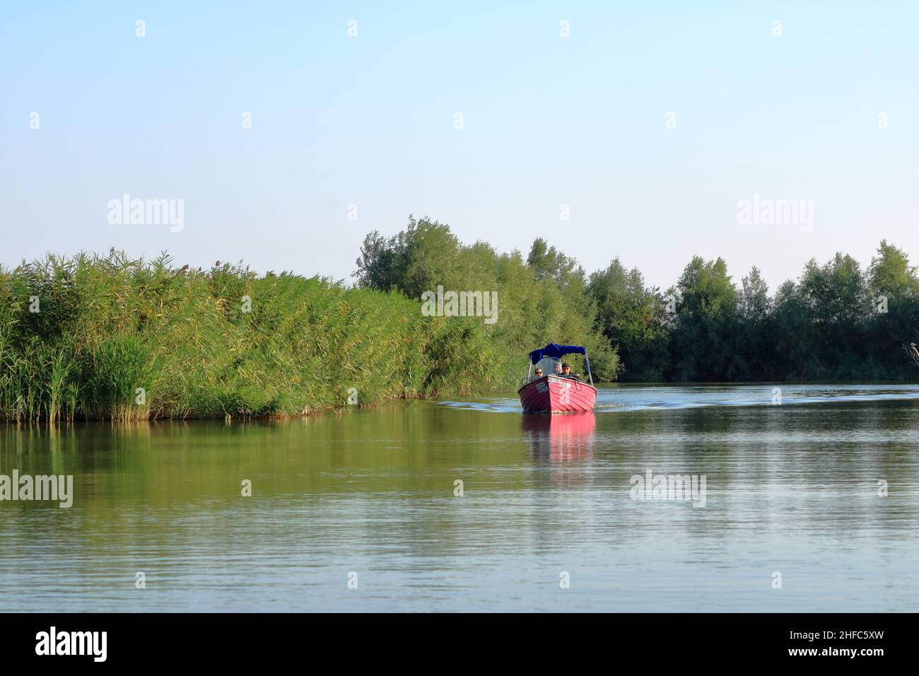 Boat for tourists in Danube Delta in Romania Stock Photo - Alamy