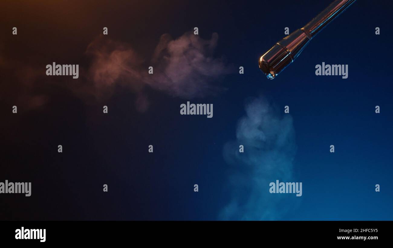 purging steam wand of coffee machine under neon lighting, wide photo ...