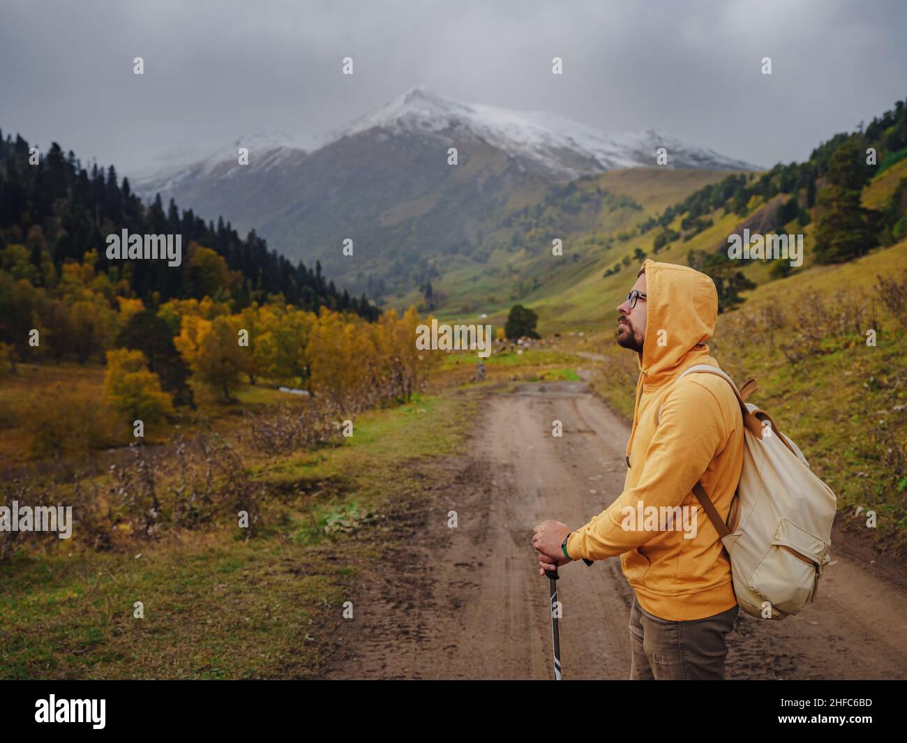 Man hikes mountains with travel backpack. Wandering lifestyle ...