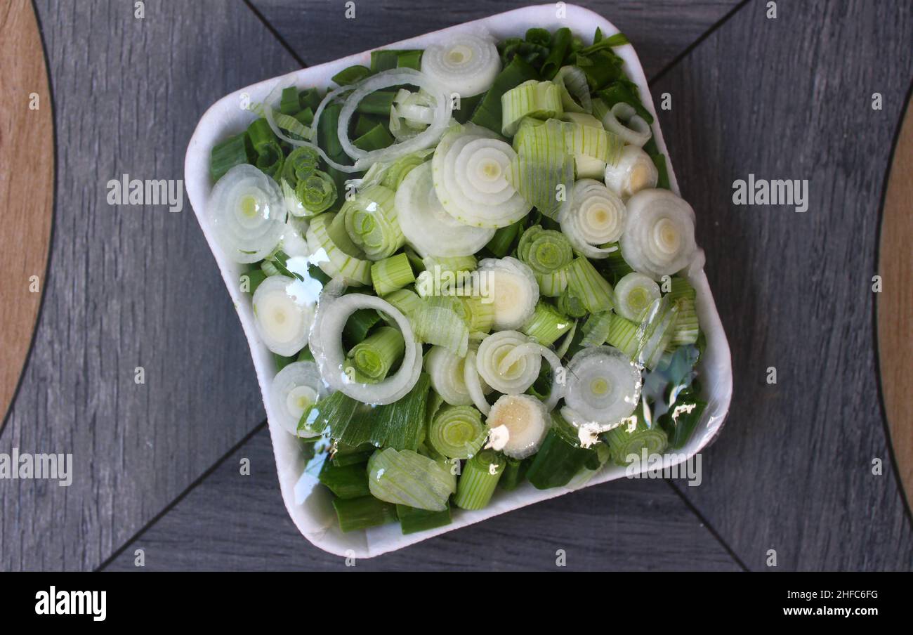 Packet of raw spring onions Stock Photo - Alamy