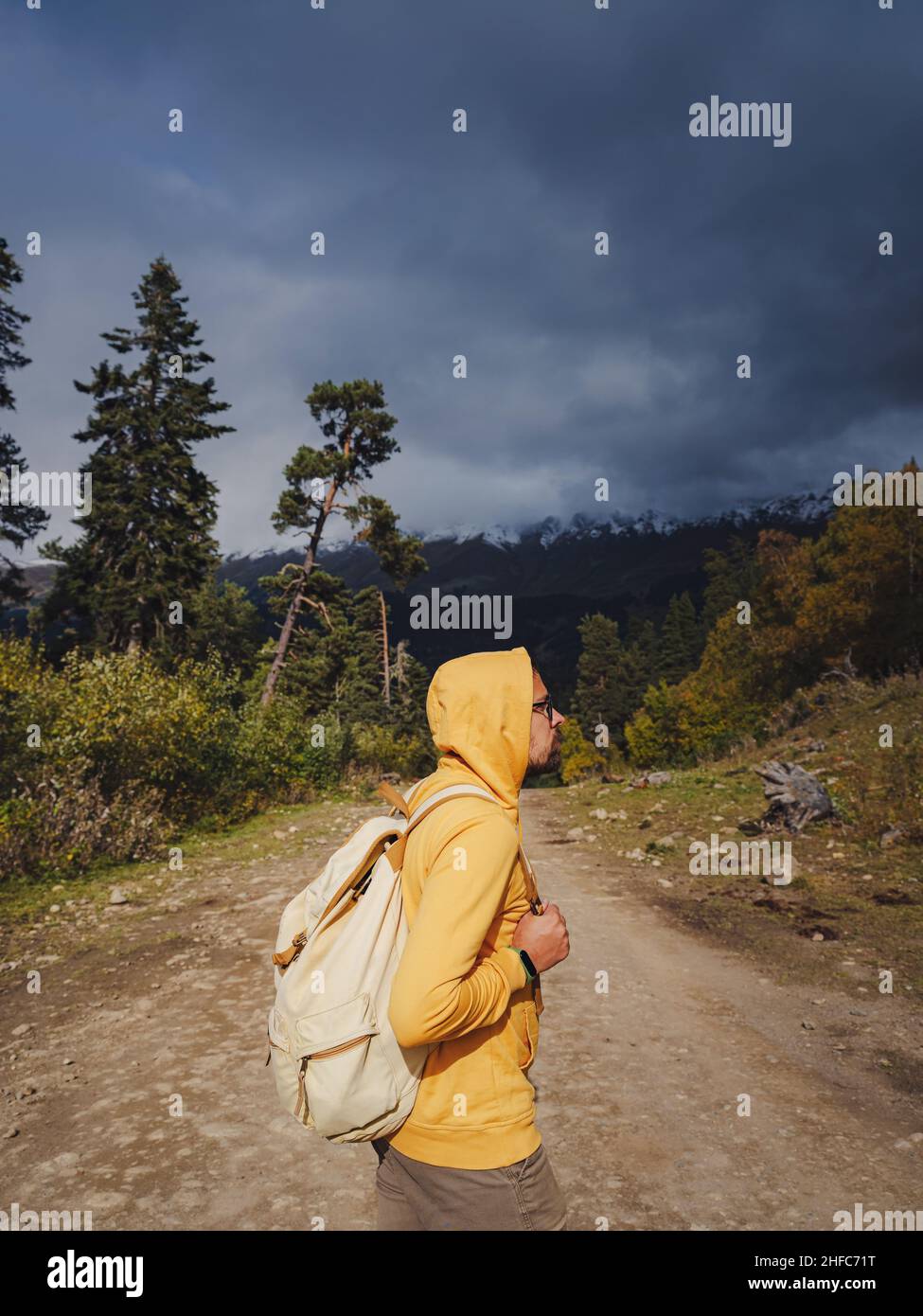 Man hikes mountains with travel backpack. Wandering lifestyle ...