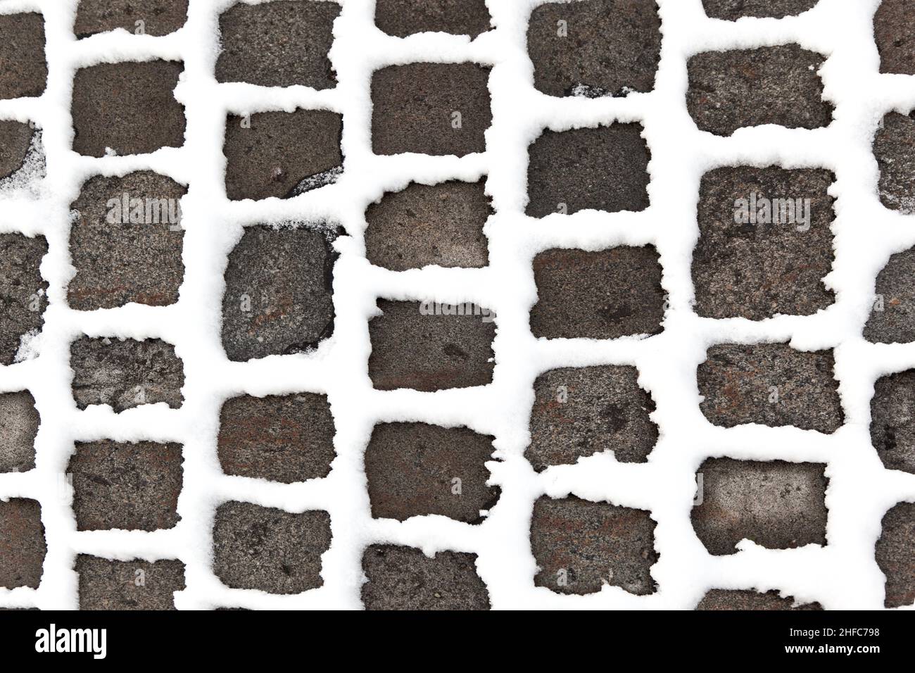 detail of cobble stone paveway in winter with snow on seam Stock Photo ...