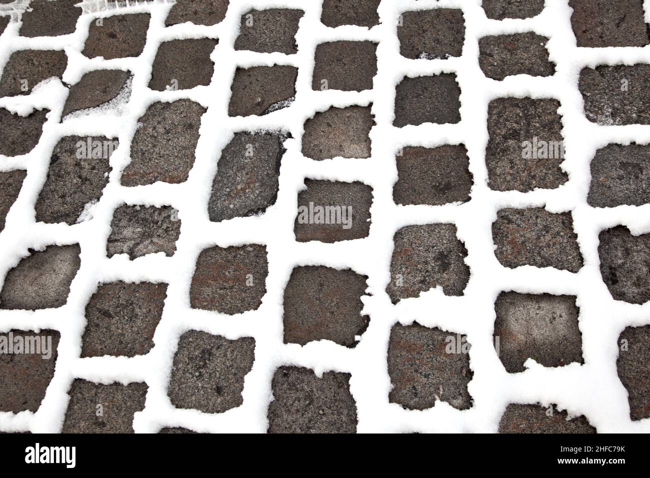 detail of cobble stone paveway in winter with snow on seam Stock Photo ...