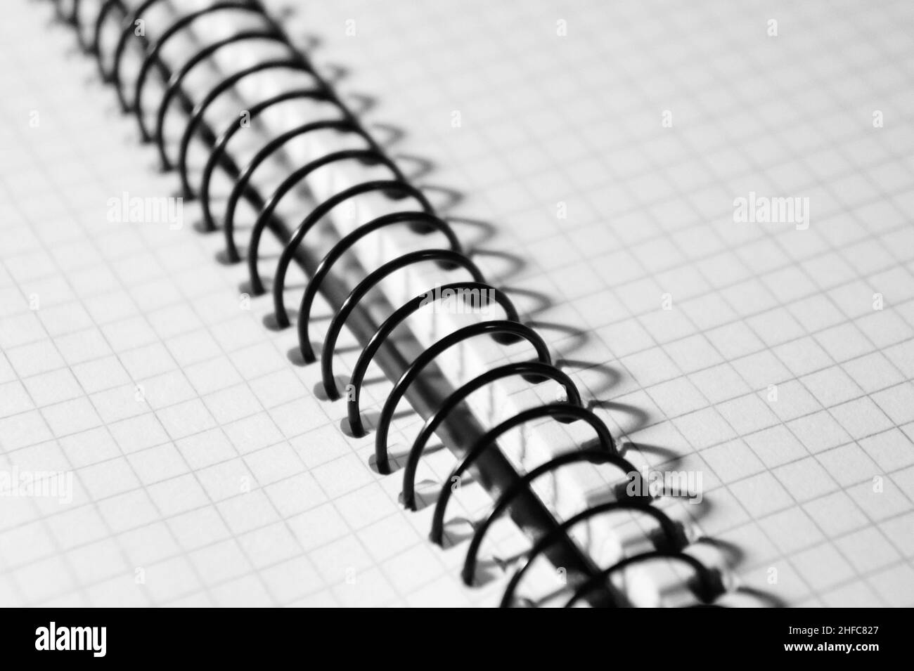 notepad in the cage, on the spring black and white Stock Photo - Alamy