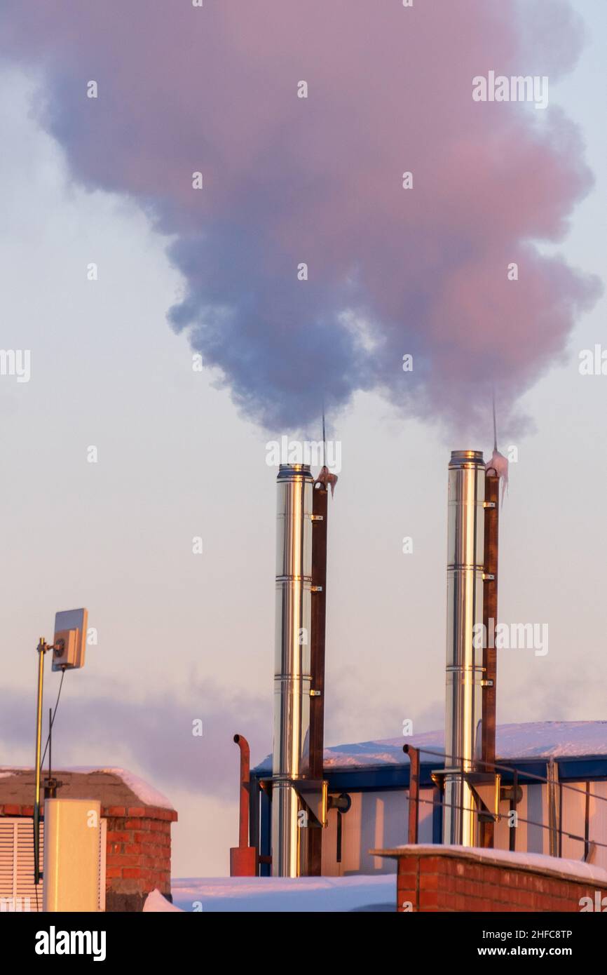 Boiler room chimney on the roof of a multi storey building. heating ...