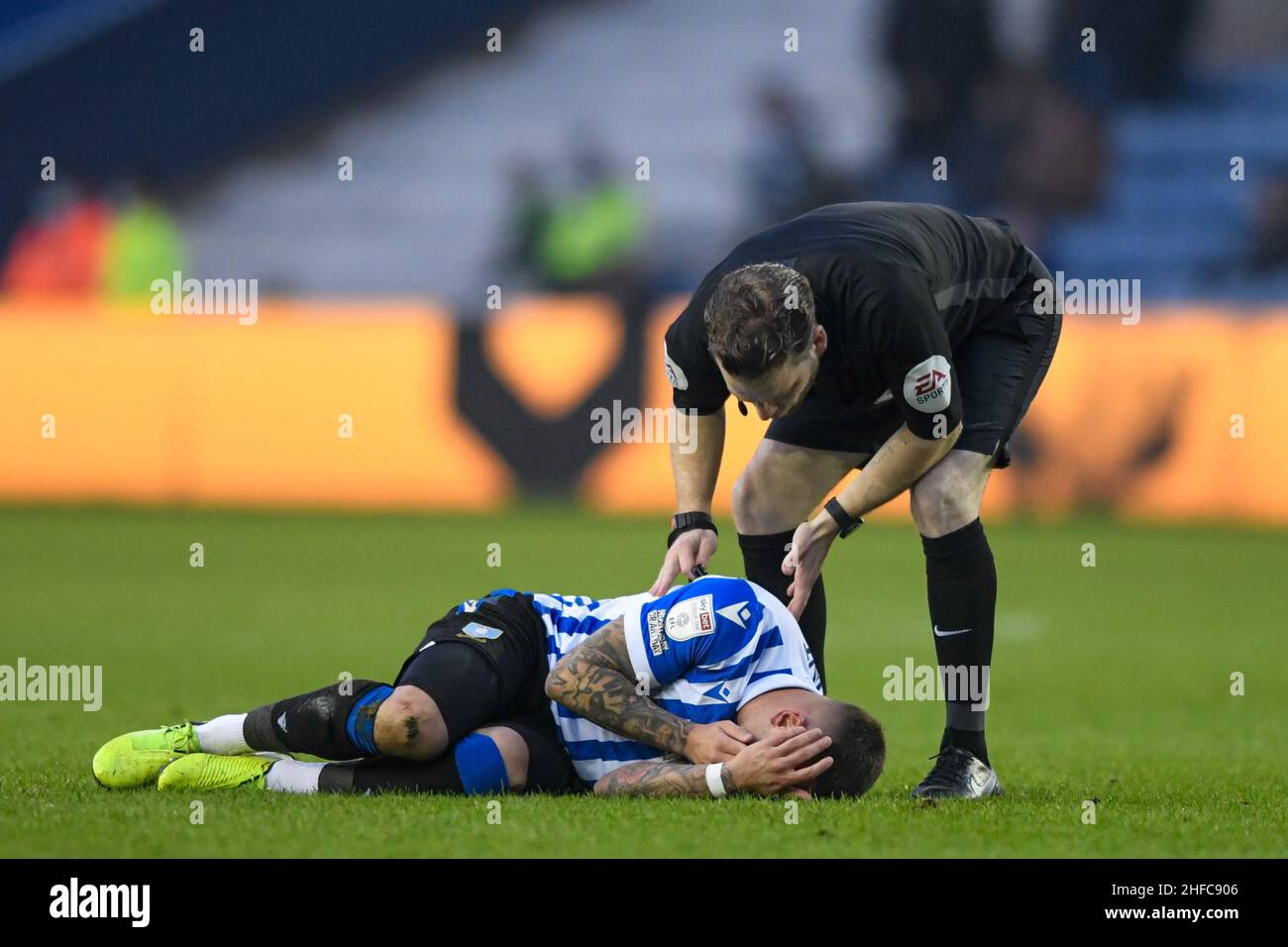 Referee Christopher Pollard checks on Jack Hunt #32 of Sheffield ...