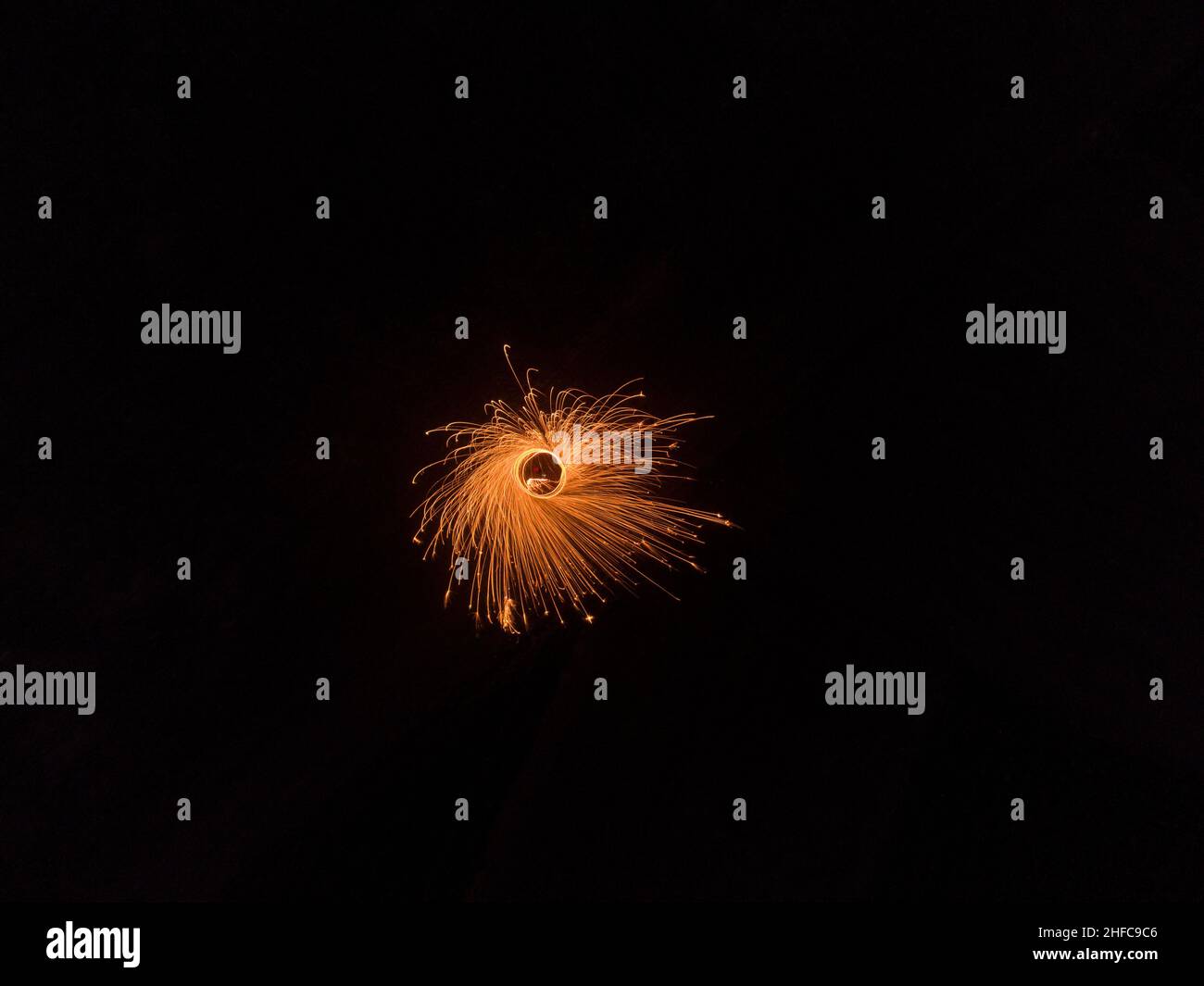 Sparks of fire fly in the darkness Stock Photo - Alamy