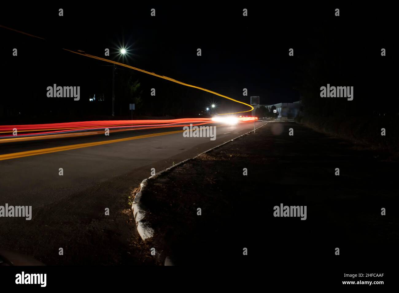 Red lights from passing cars Stock Photo - Alamy