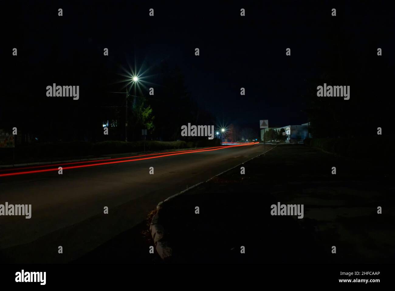 Red lights from passing cars Stock Photo - Alamy