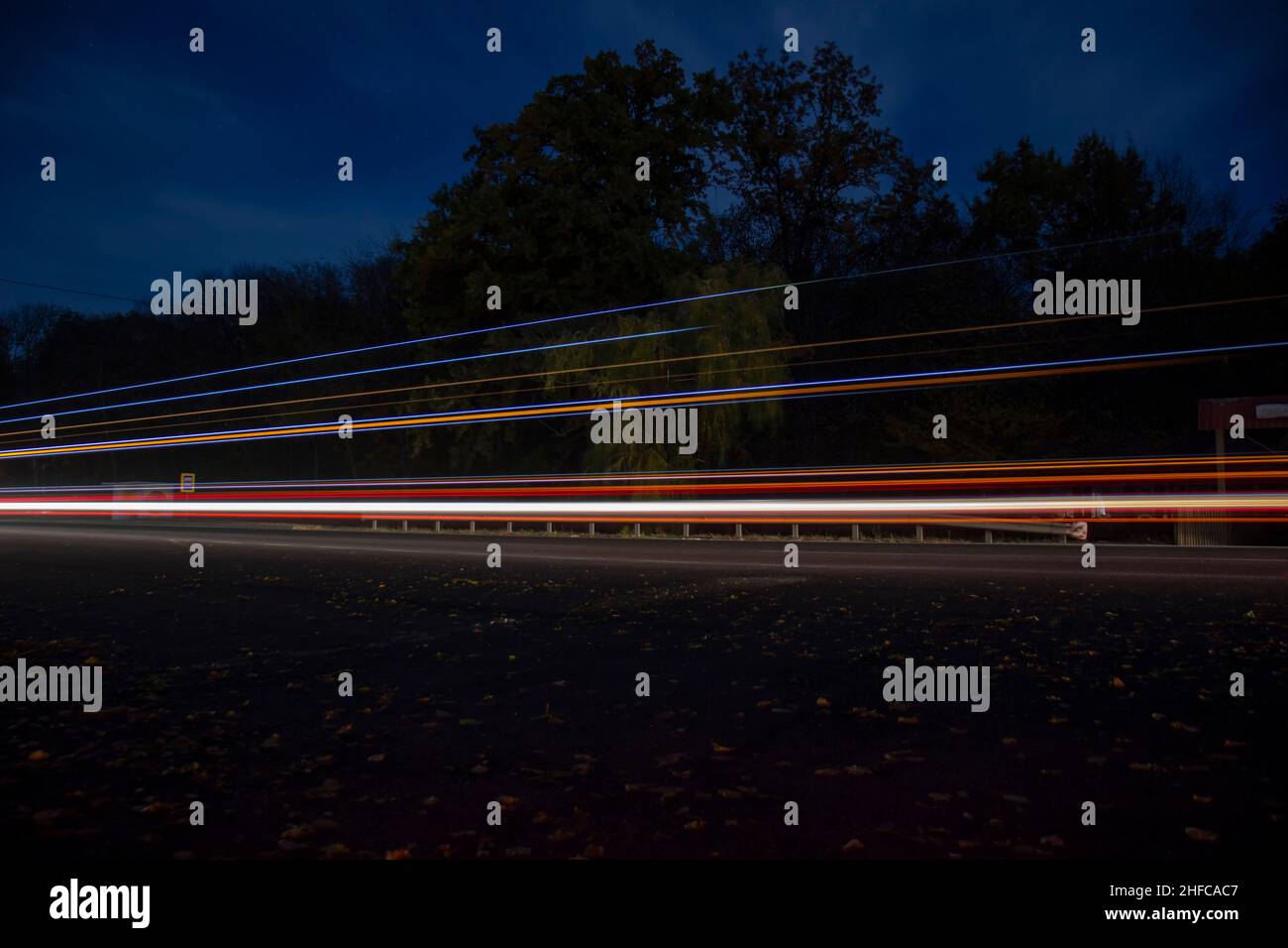 Cars passing modern city background hi-res stock photography and images ...
