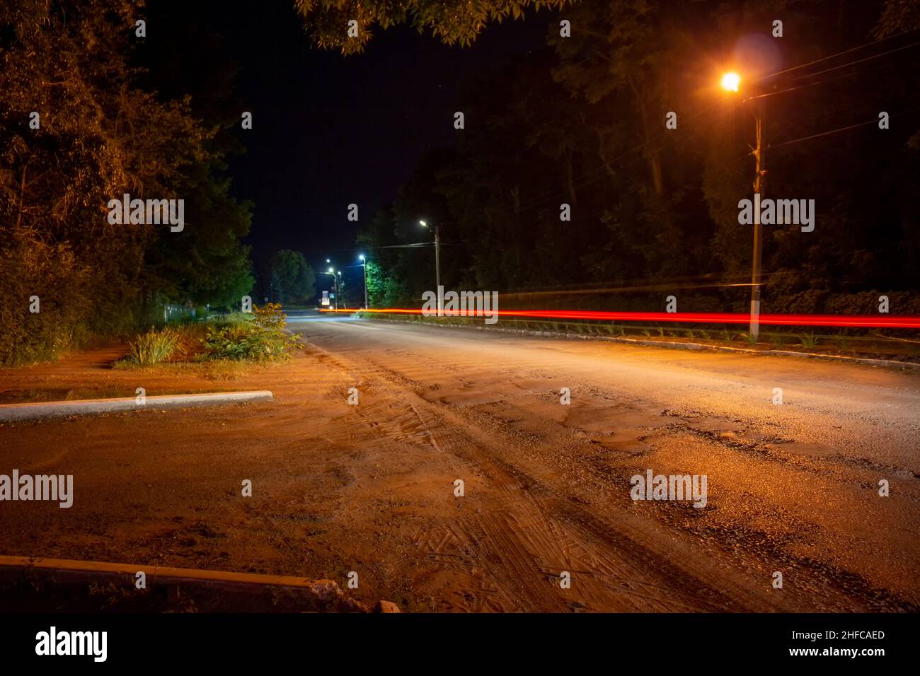 Cars passing on asphalt road hi-res stock photography and images - Alamy