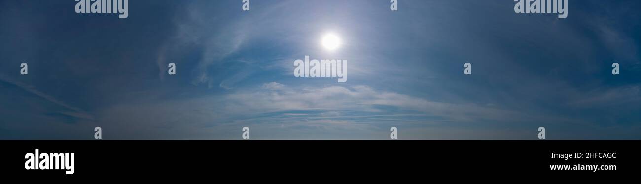 The sun shines through the cirrus clouds Stock Photo - Alamy