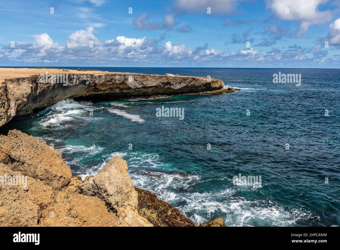 Rocky cliff where people cave dive Aruba Stock Photo - Alamy
