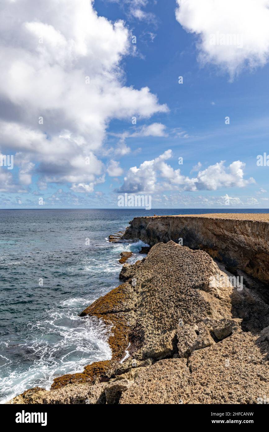 Rocky cliff where people cave dive Aruba Stock Photo - Alamy
