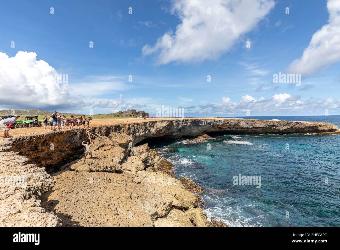 Rocky cliff where people cave dive Aruba Stock Photo - Alamy
