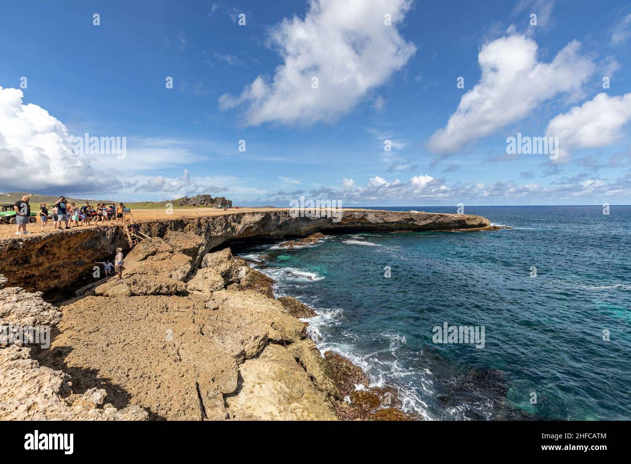 Rocky cliff where people cave dive Aruba Stock Photo - Alamy